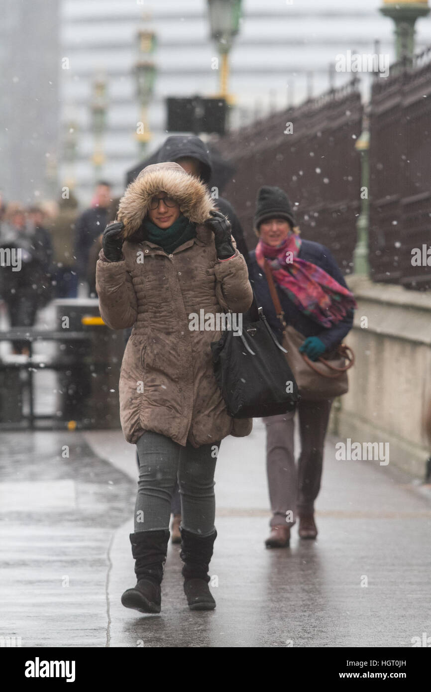 London, UK. 13th Jan, 2017. Pedestrians on Westminster bridge brave the ...