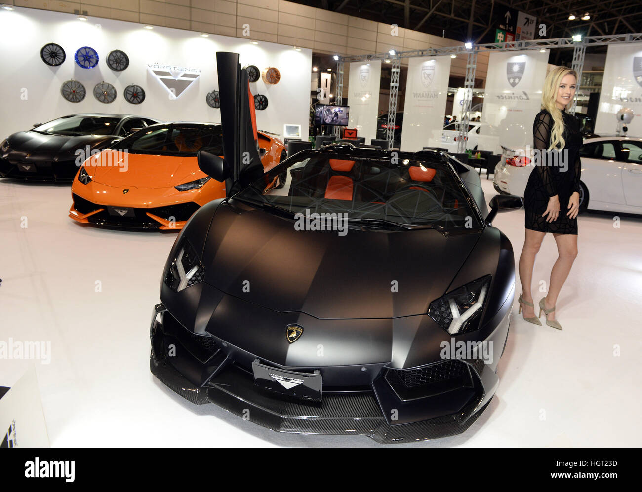 Tokyo, Japan. 13th Jan, 2017. A model poses beside a Lamborghini ...