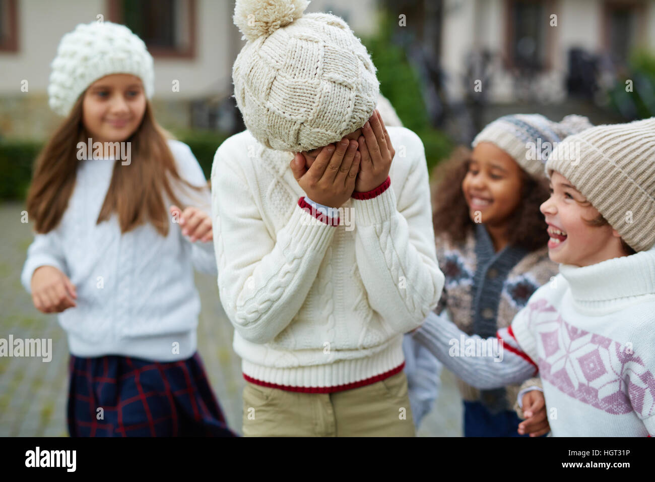 Youthful lad crying among his laughing classmates Stock Photo - Alamy