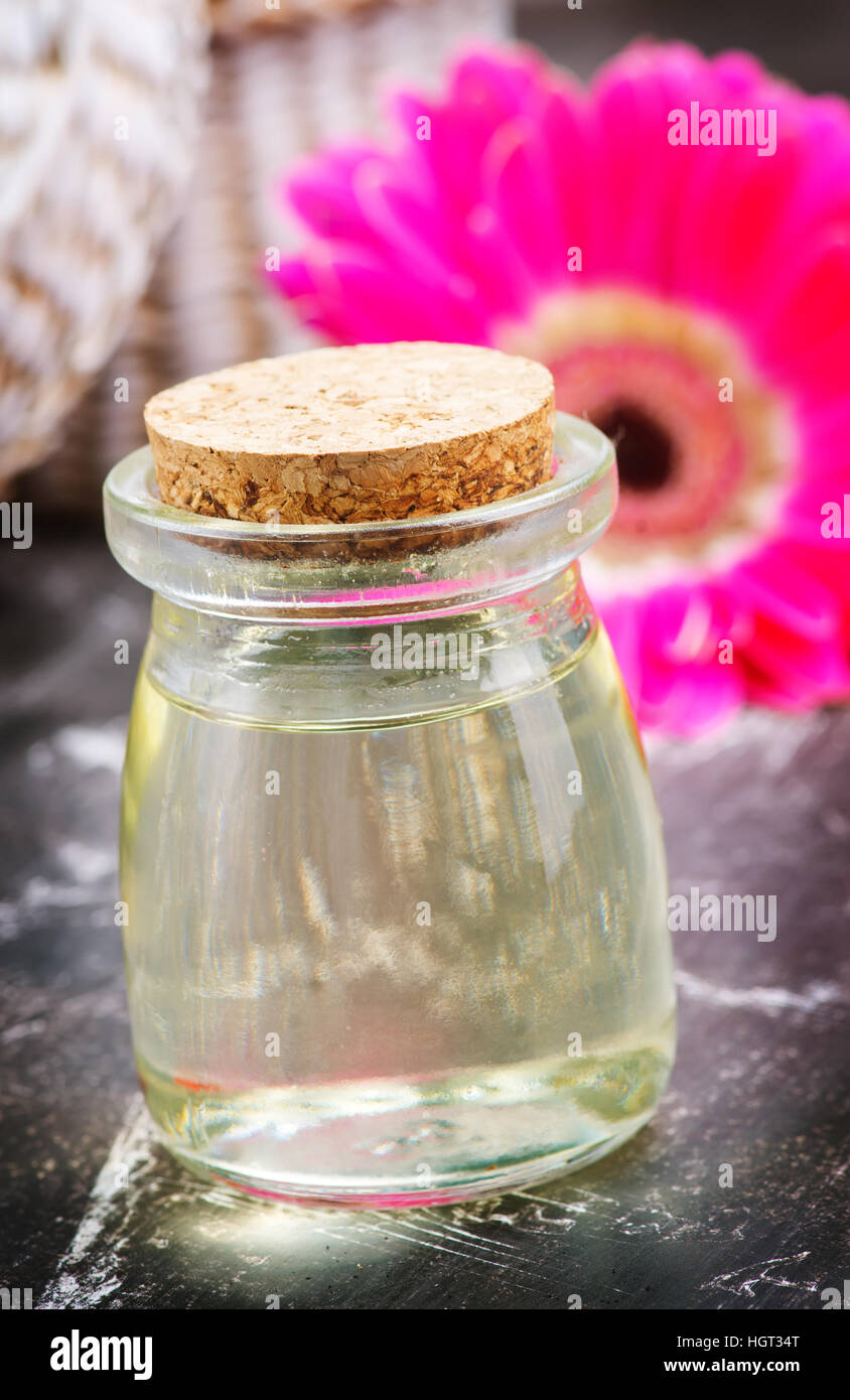 aroma oil in glass bottle and on a table Stock Photo - Alamy