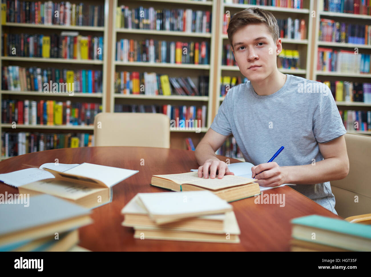Guy carrying out school assignment or getting ready for seminar Stock ...