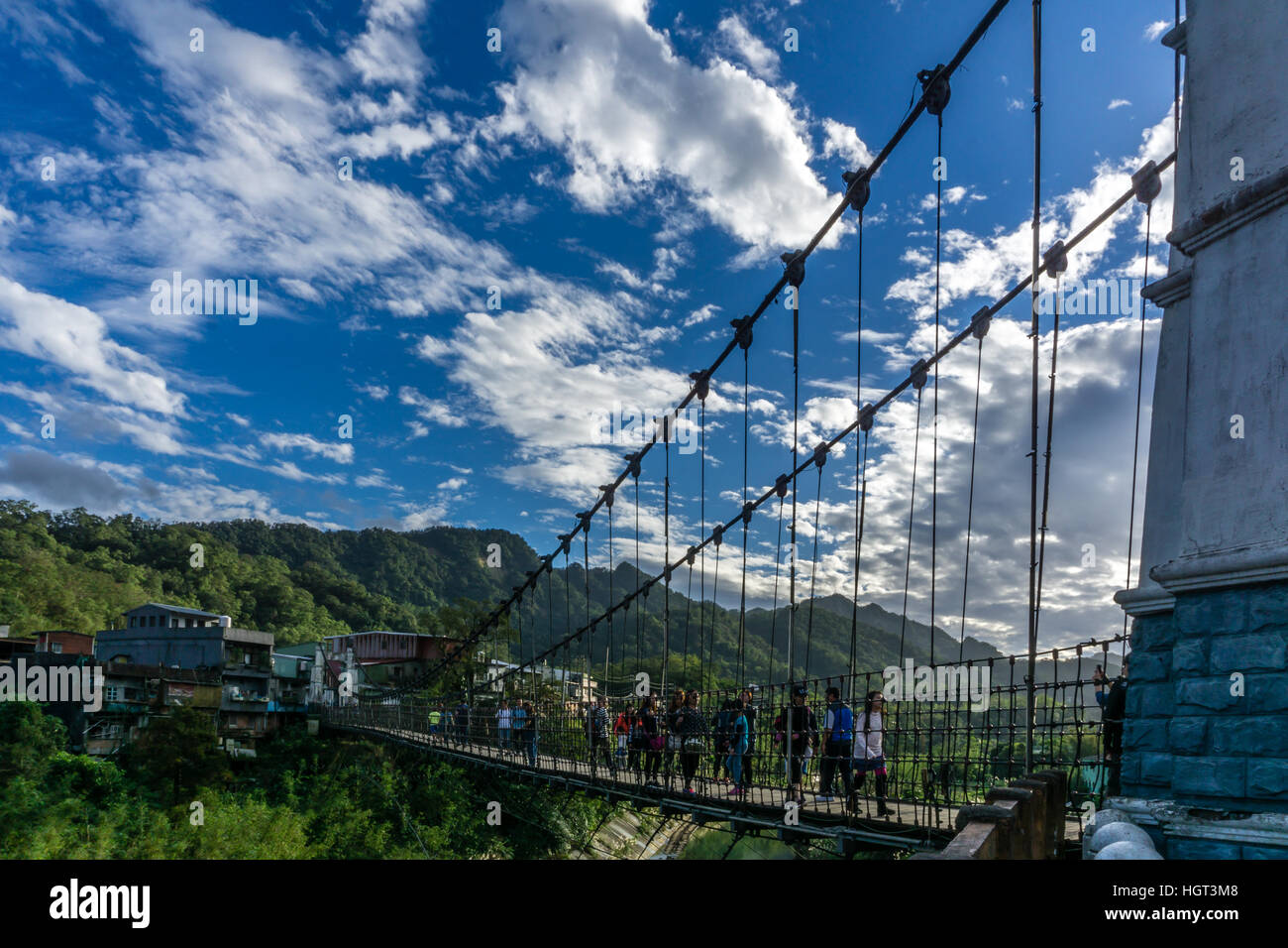 Group of people walking on a bridg Stock Photo - Alamy