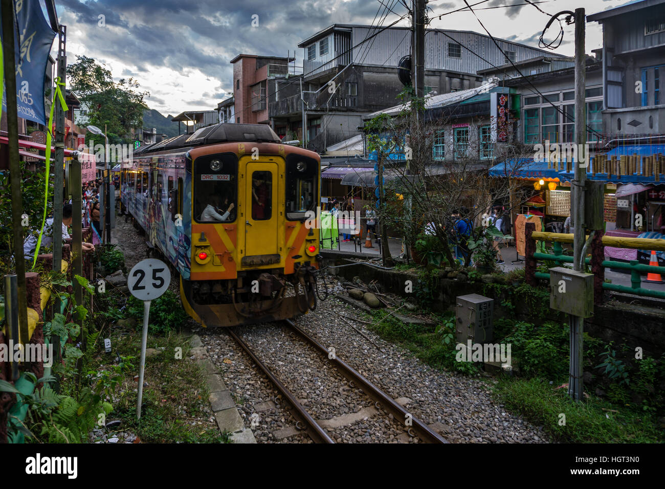 Train passing by the station Stock Photo - Alamy