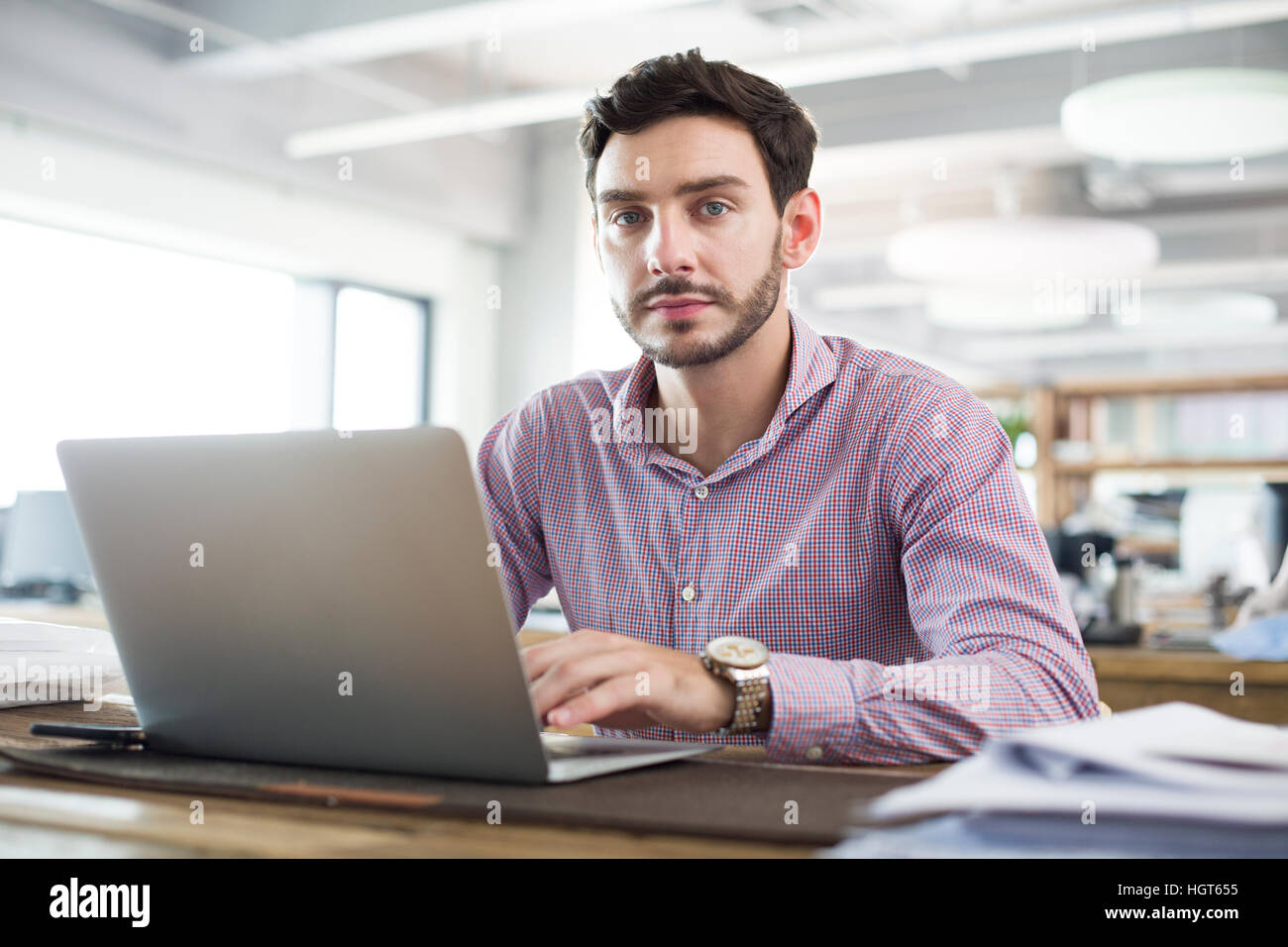 Male architect working with laptop in the office Stock Photo - Alamy