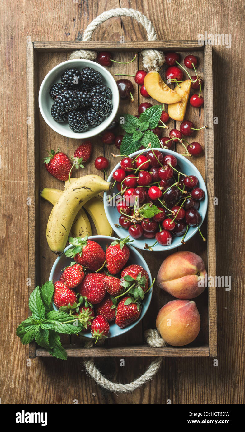 Summer fresh fruit and berry variety in rustic wooden tray Stock Photo ...