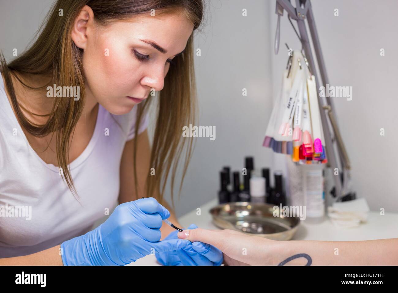 Woman manicure master makes gel hi-res stock photography and images - Alamy