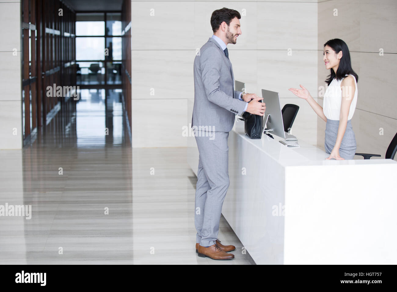 Office receptionist standing hi-res stock photography and images - Alamy