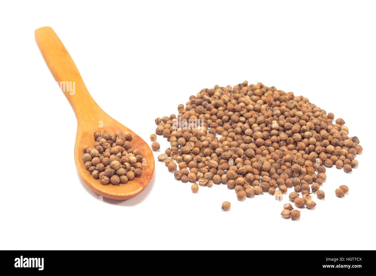 Coriander seeds with spoon isolated on white Stock Photo - Alamy