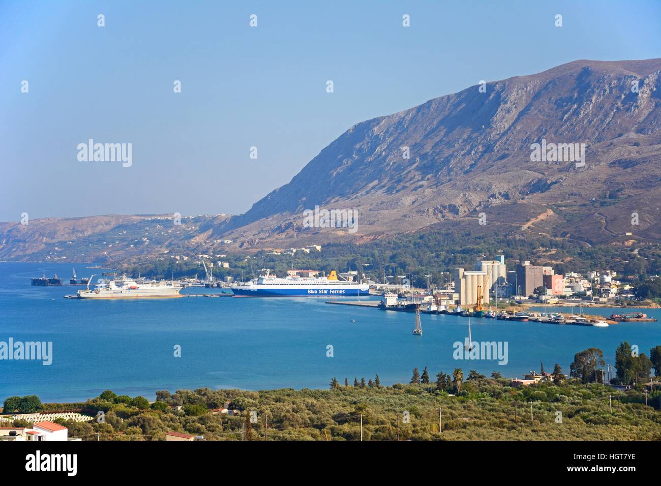 Ferries moored in the port with views along the coastline, Chania ...