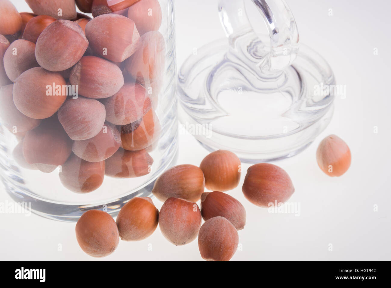 Hazelnuts in glass jar on a white background. Isolated. nuts Stock ...