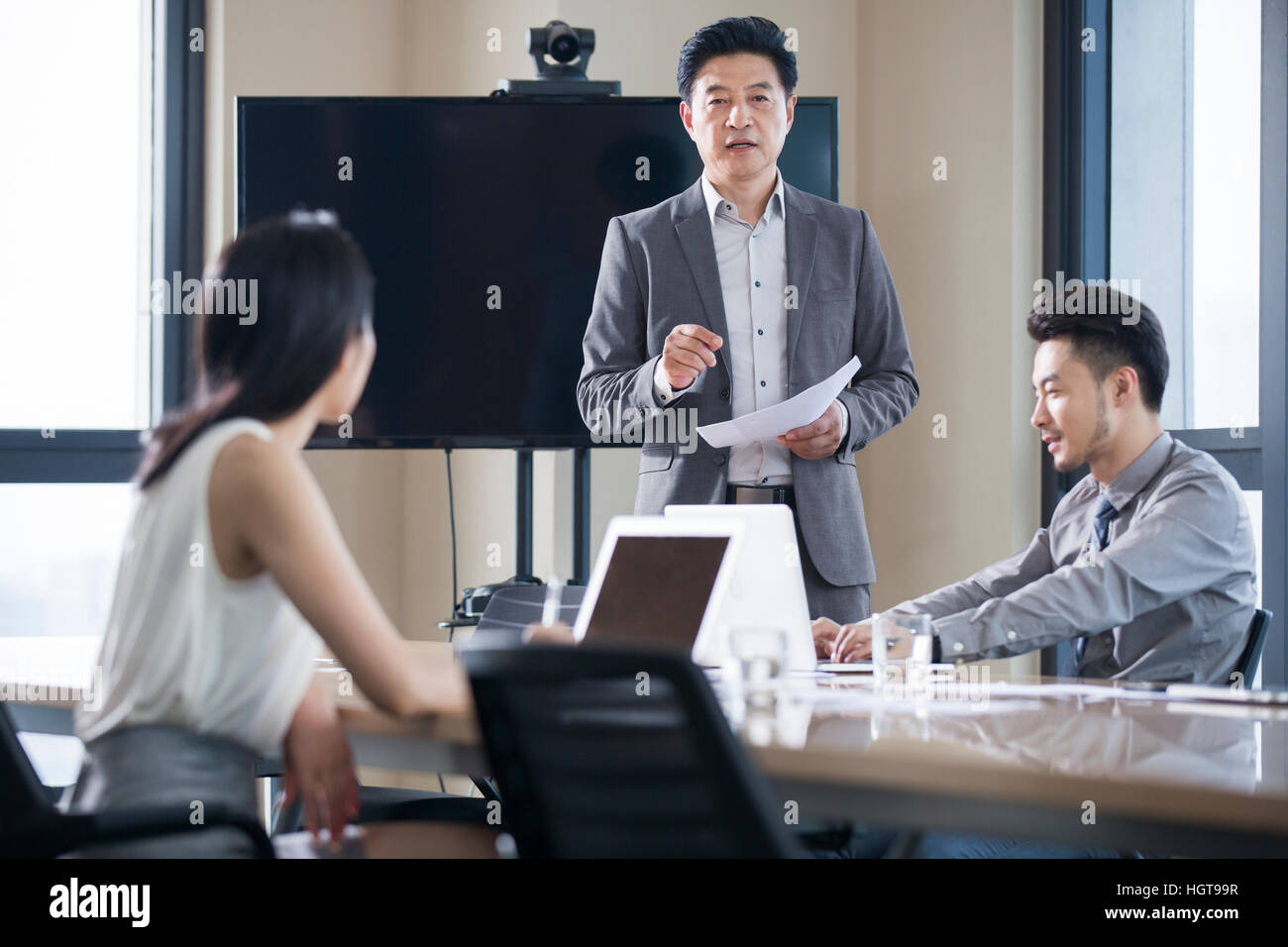 Business people talking in meeting room Stock Photo - Alamy