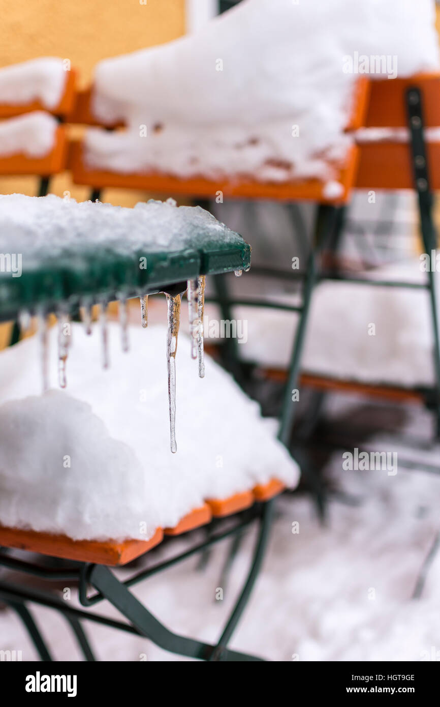 Tables and Chairs with Icicles Covered with a Thick Layer of Snow ...