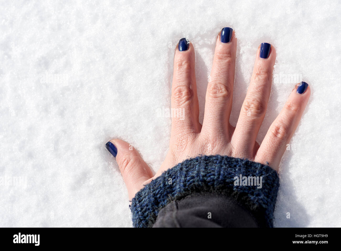 Woman Hand in Cold Snow Close Up Stock Photo - Alamy