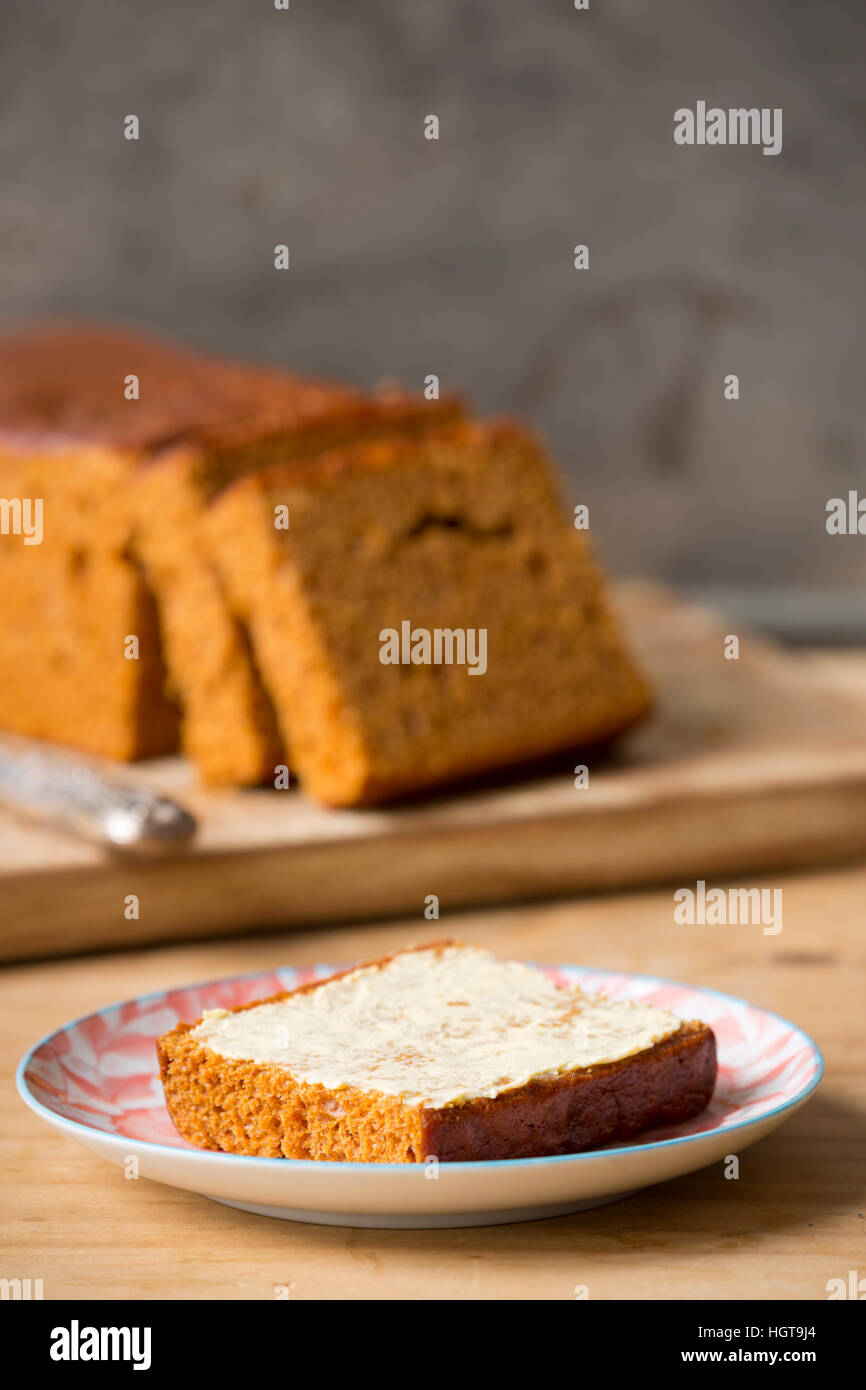 Slices of 'ontbijtkoek', traditional Dutch spice bread, with butter ...