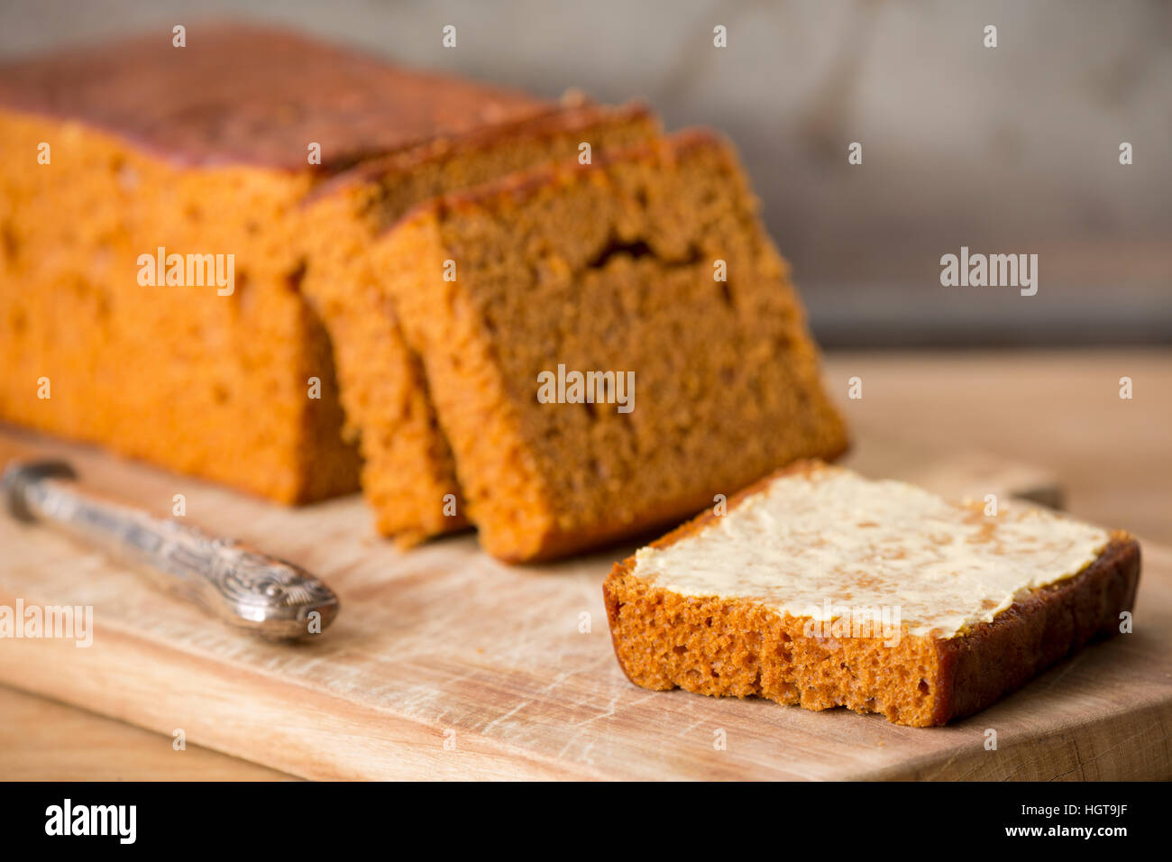 Slices of 'ontbijtkoek', traditional Dutch spice bread, with butter ...