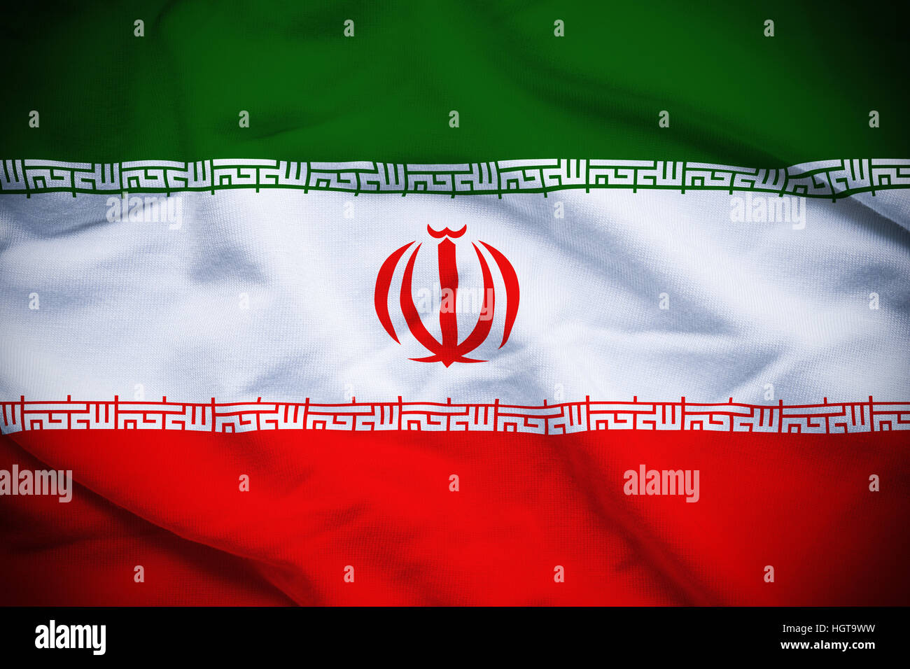 Wavy and rippled national flag of Iran background Stock Photo - Alamy