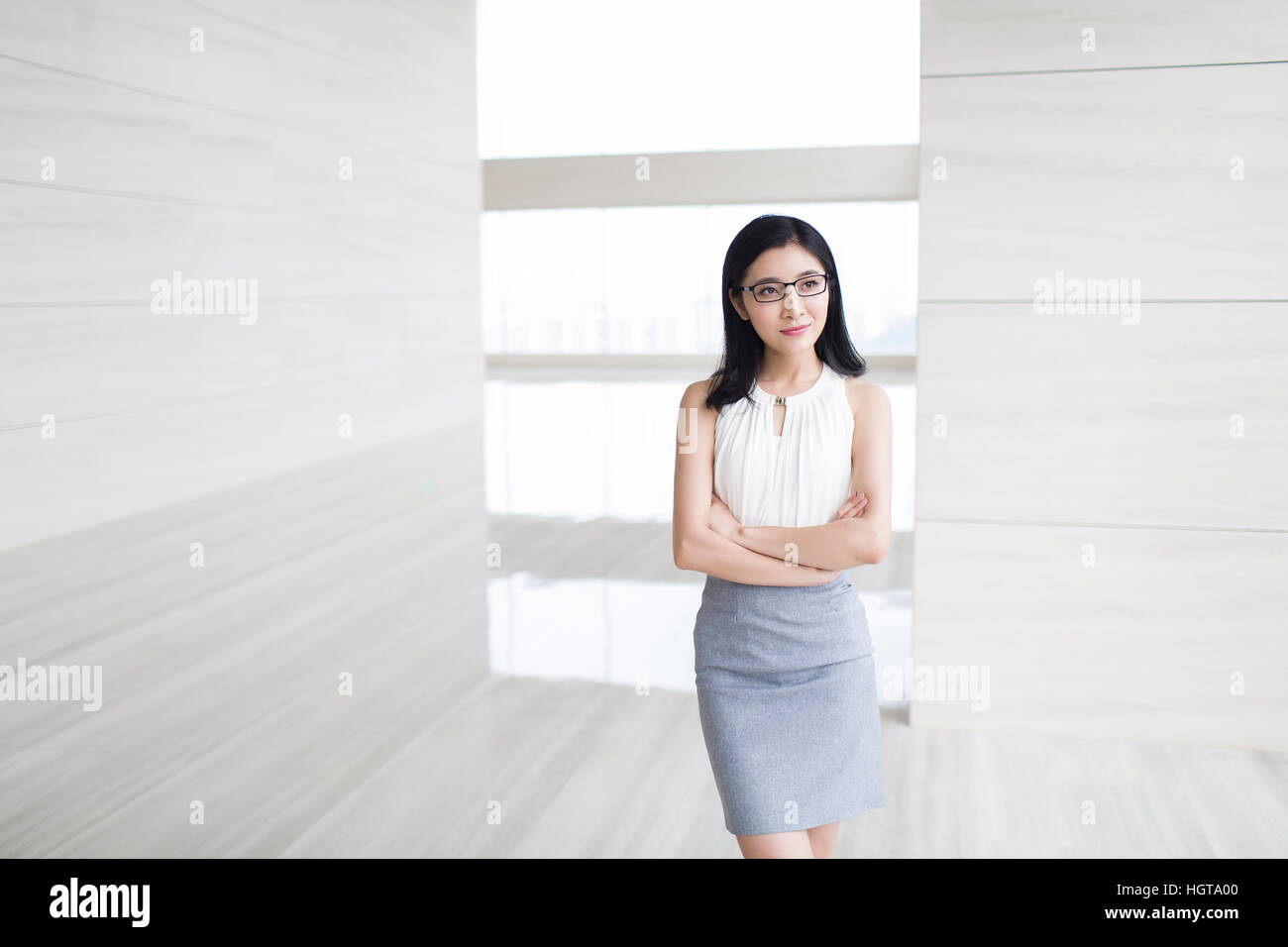 Confident young businesswoman Stock Photo - Alamy