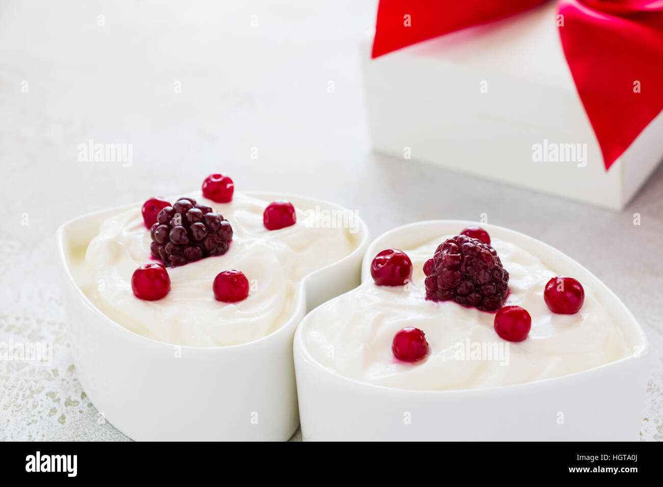 Valentine day decoration, breakfast, yogurt with berries for two in ...