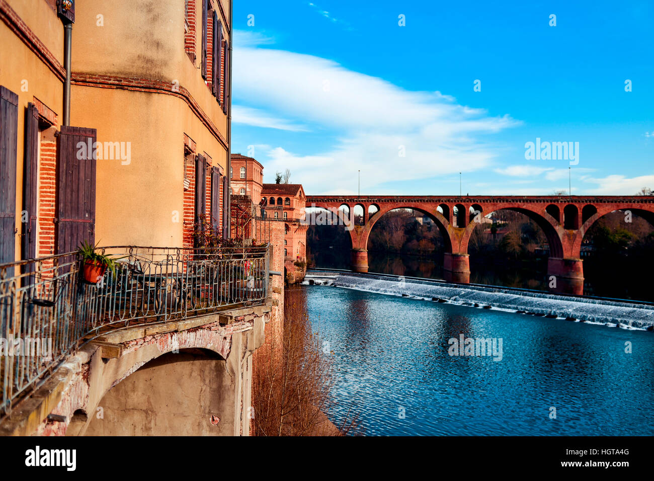 a view of the Tarn River as it passes through Albi, in France, with the ...