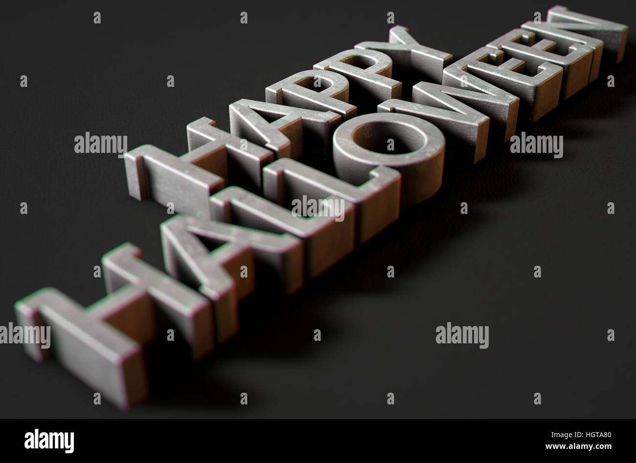 A 3D render of metal extruded text spelling out the phrase Happy ...