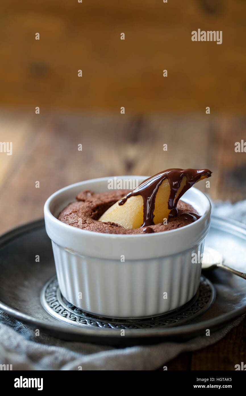 Chocolate sponge cake with poached pear Stock Photo - Alamy