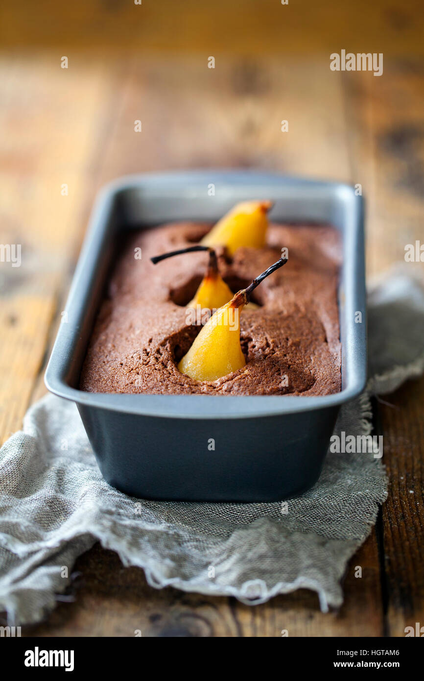 Chocolate sponge cake with poached pear Stock Photo - Alamy