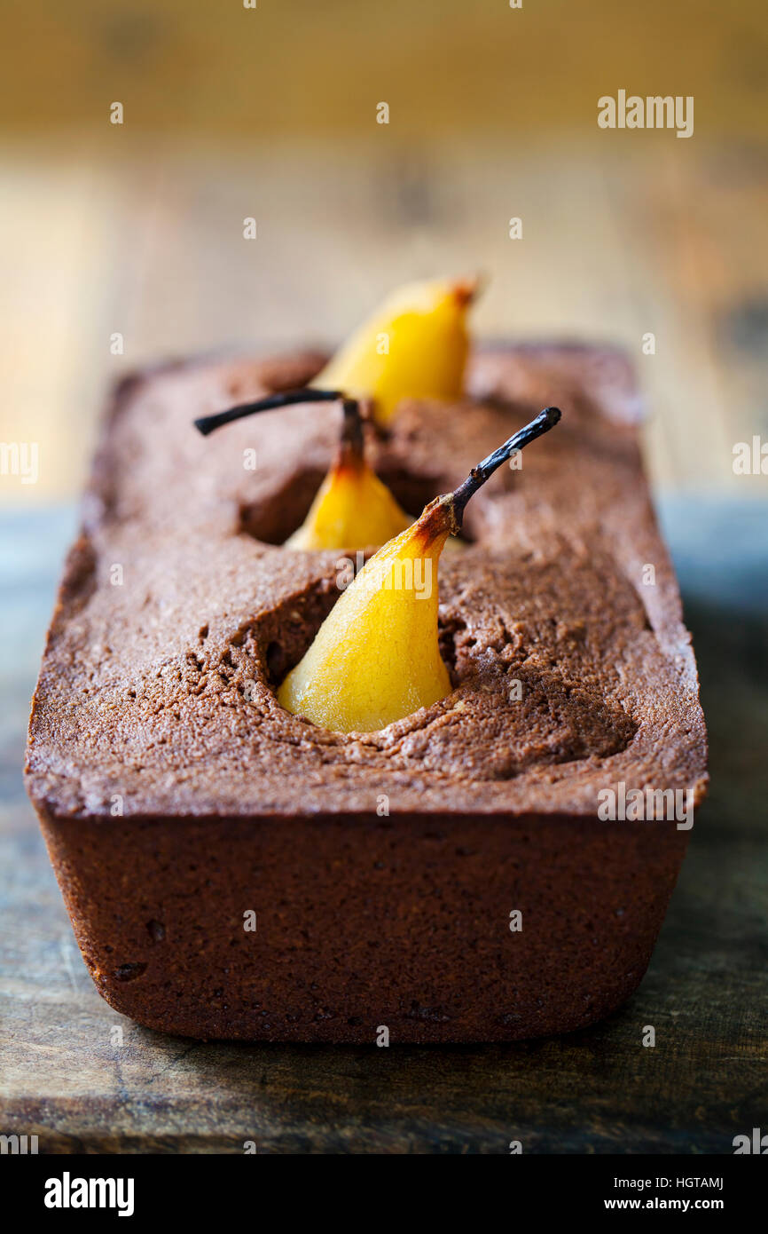 Chocolate sponge cake with poached pear Stock Photo - Alamy