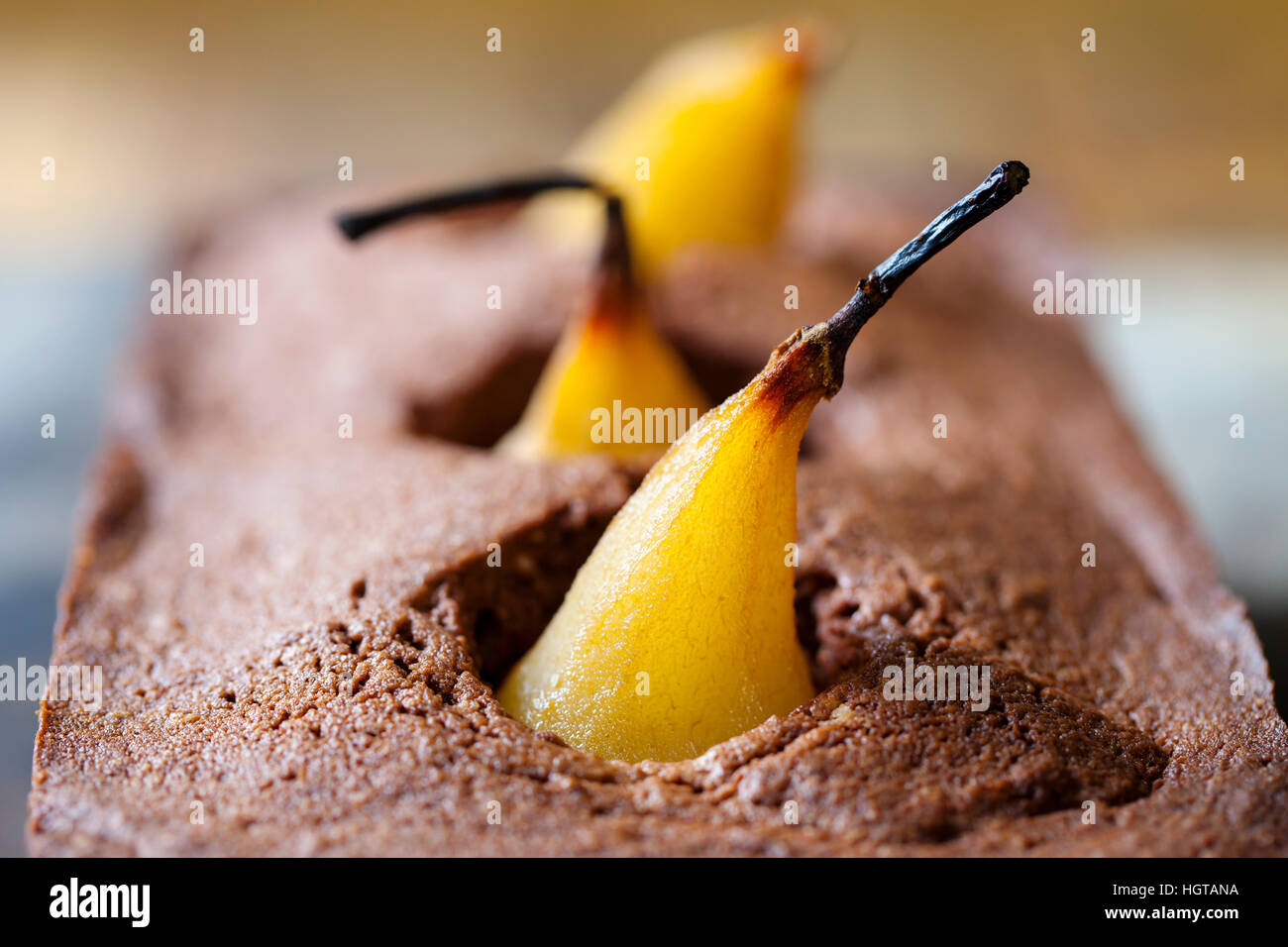 Chocolate sponge cake with poached pear Stock Photo - Alamy