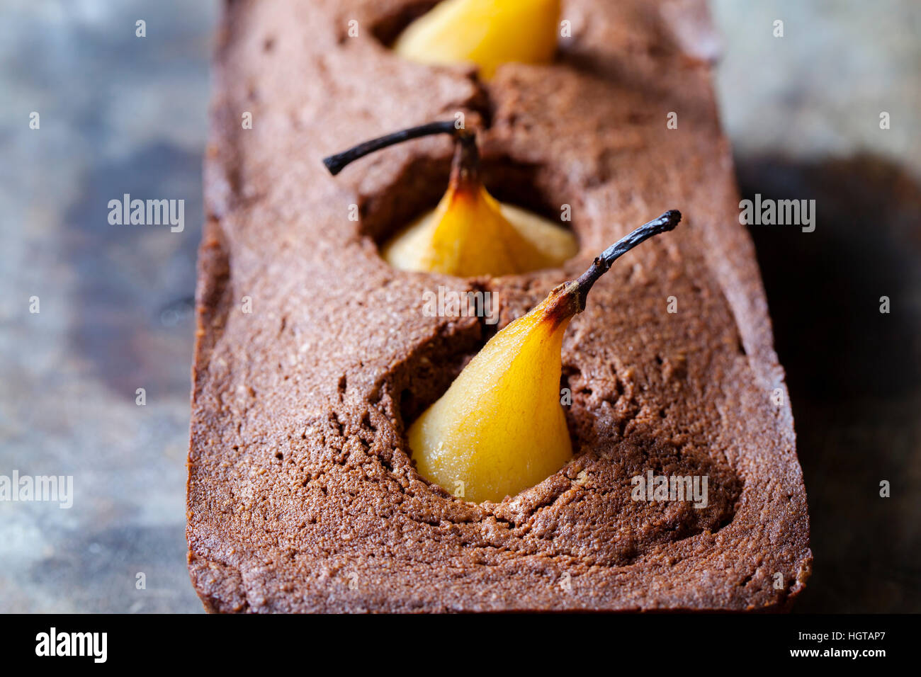 Chocolate sponge cake with poached pear Stock Photo - Alamy