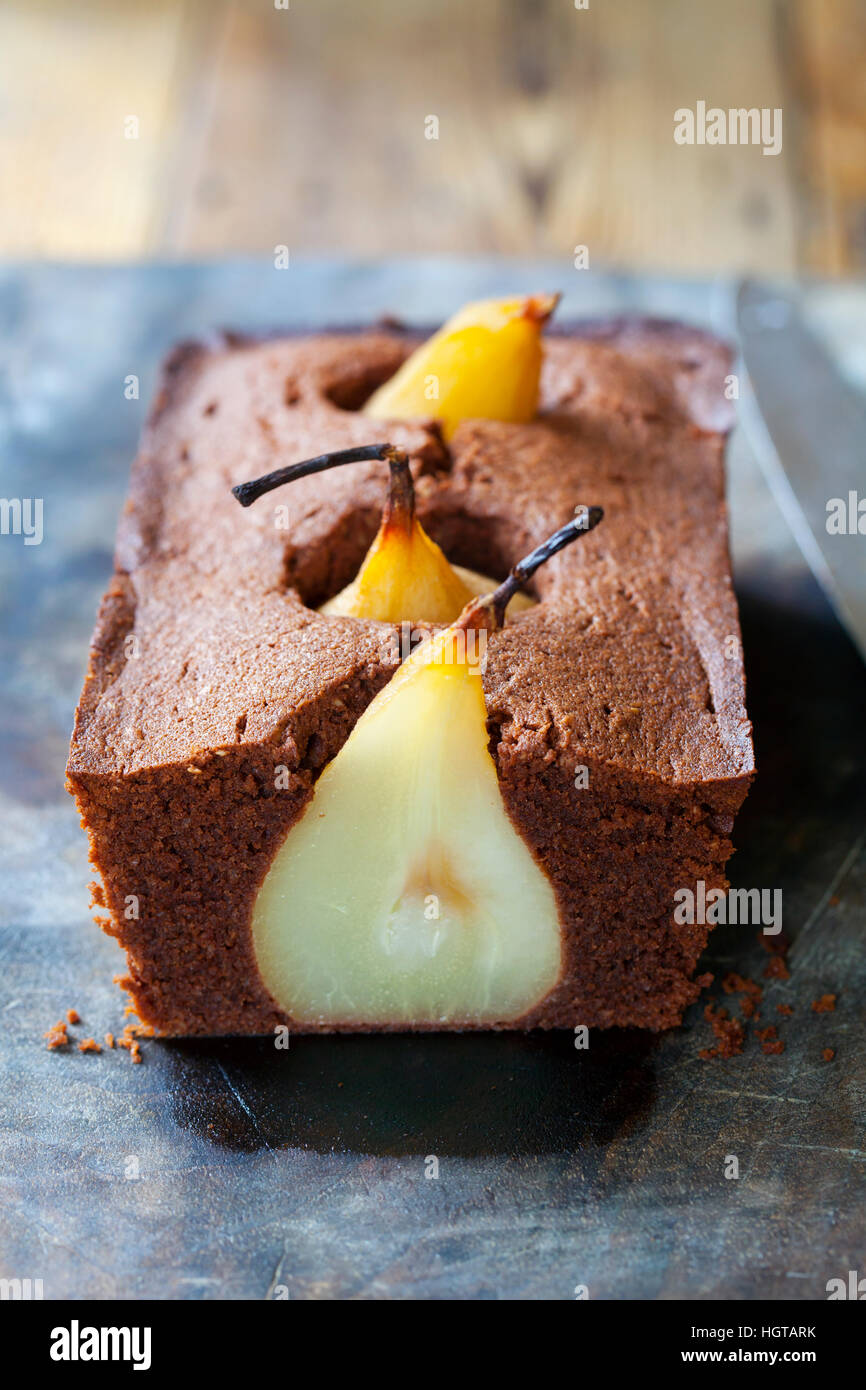 Chocolate sponge cake with poached pear Stock Photo - Alamy