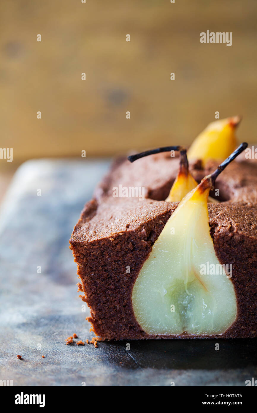 Chocolate sponge cake with poached pear Stock Photo - Alamy