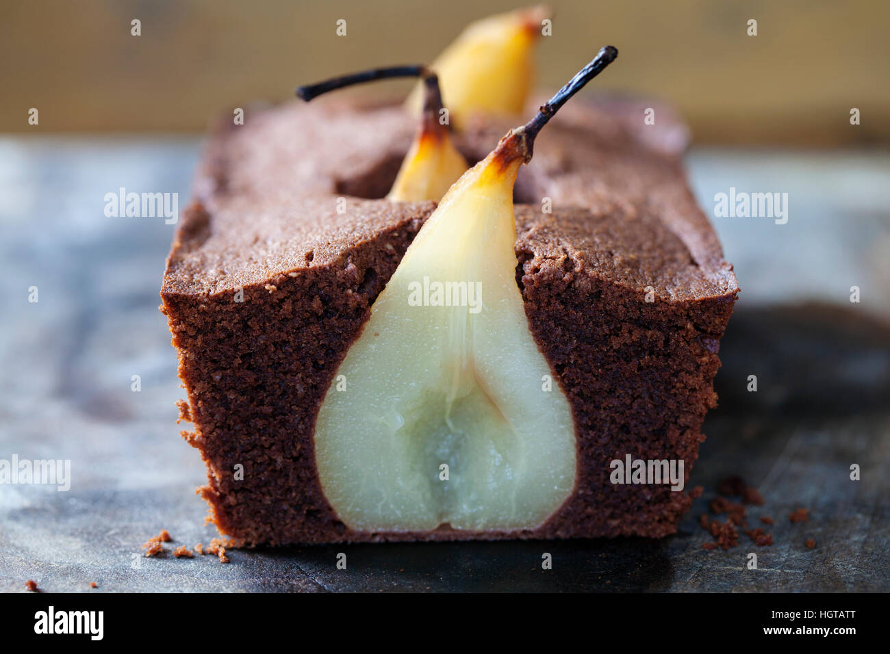 Chocolate sponge cake with poached pear Stock Photo - Alamy