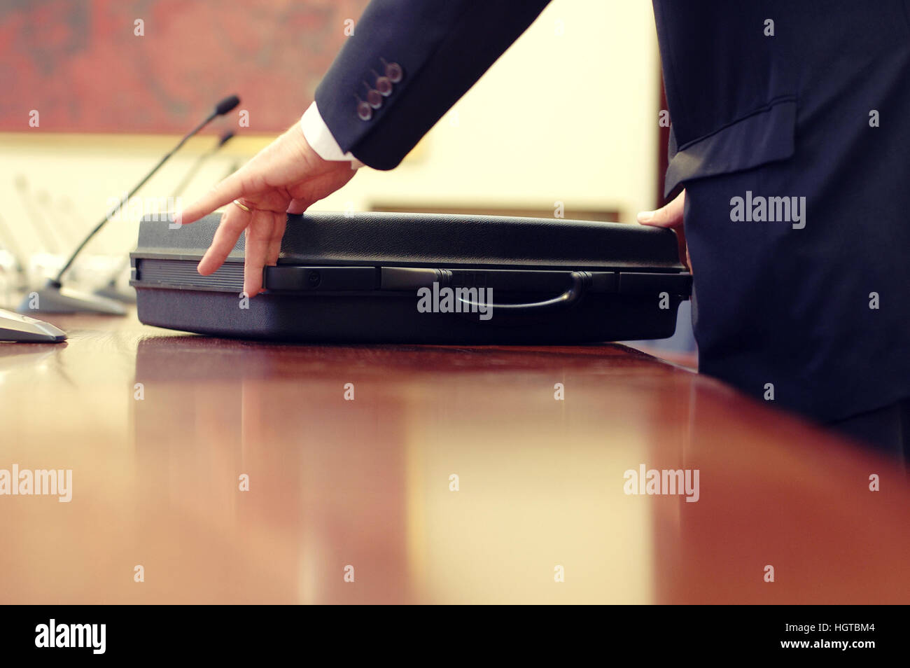 Business meeting detail, businessman closing briefcase at the end of ...