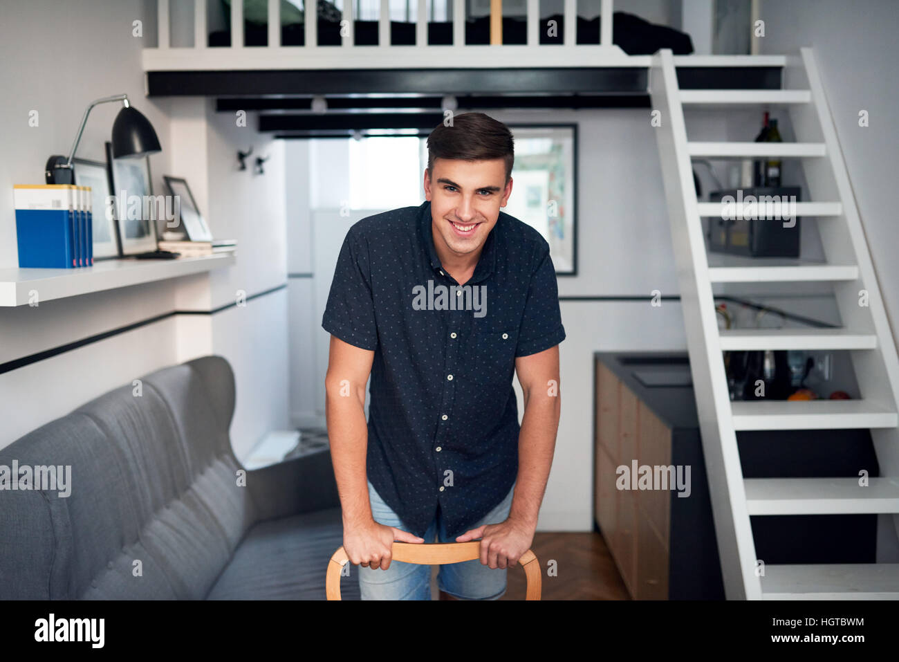 Man in loft apartment hi-res stock photography and images - Alamy
