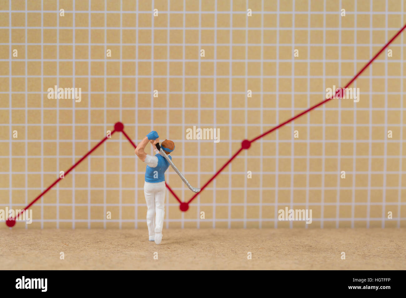 Figure of golfer and graph Stock Photo - Alamy