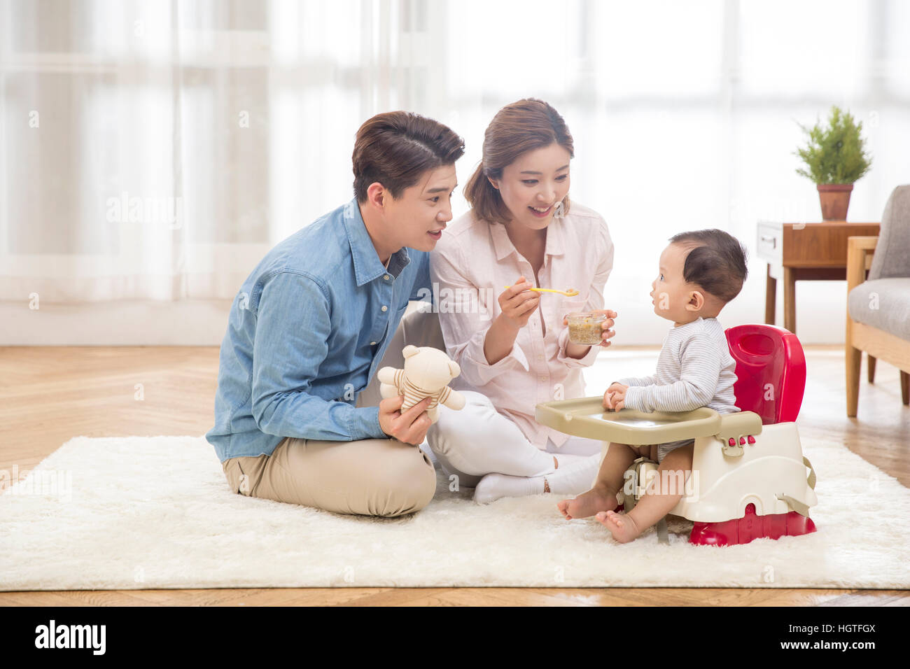 Harmonious family with baby Stock Photo - Alamy