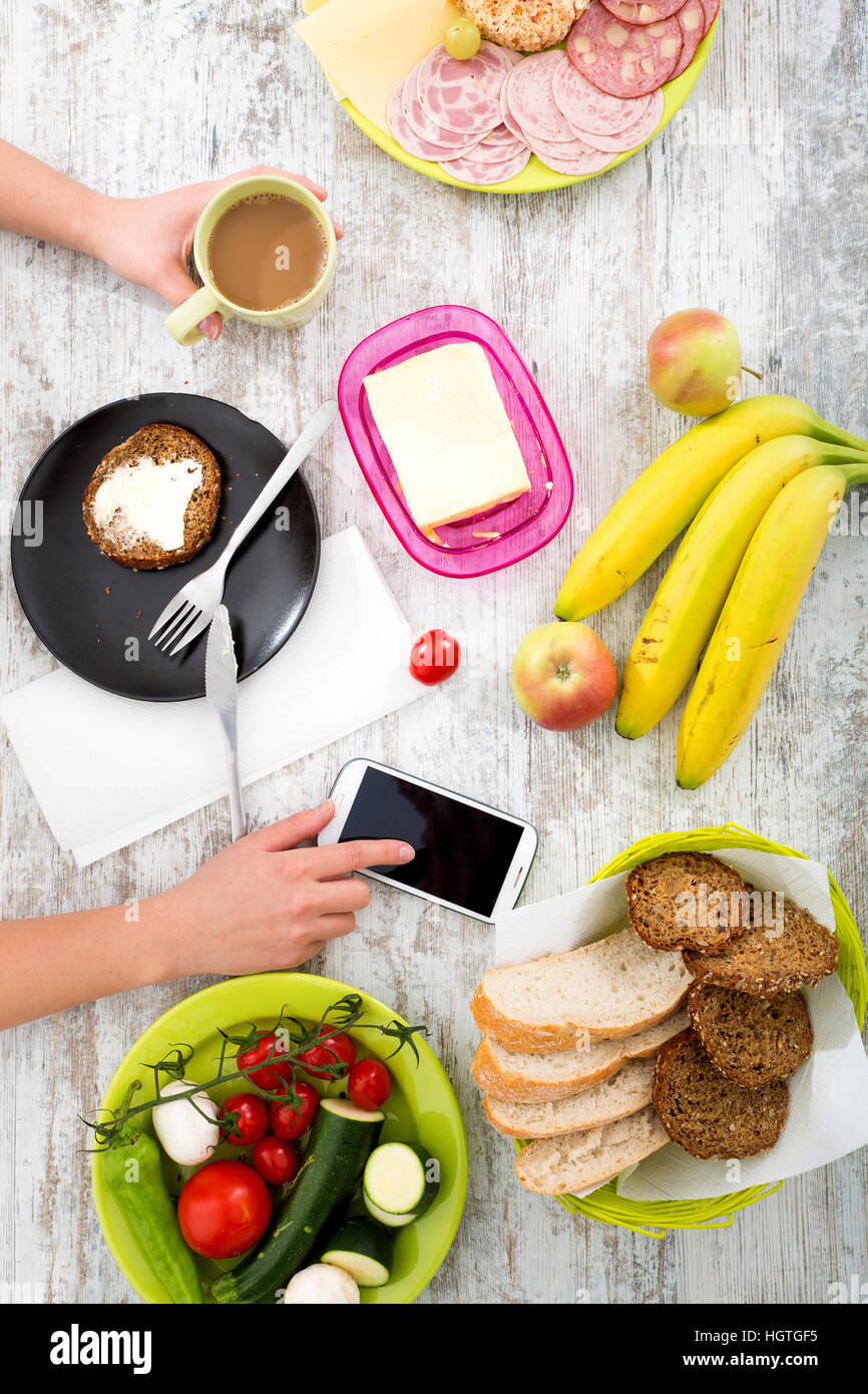 Woman with a phone at the table of a cafe hi-res stock photography and ...