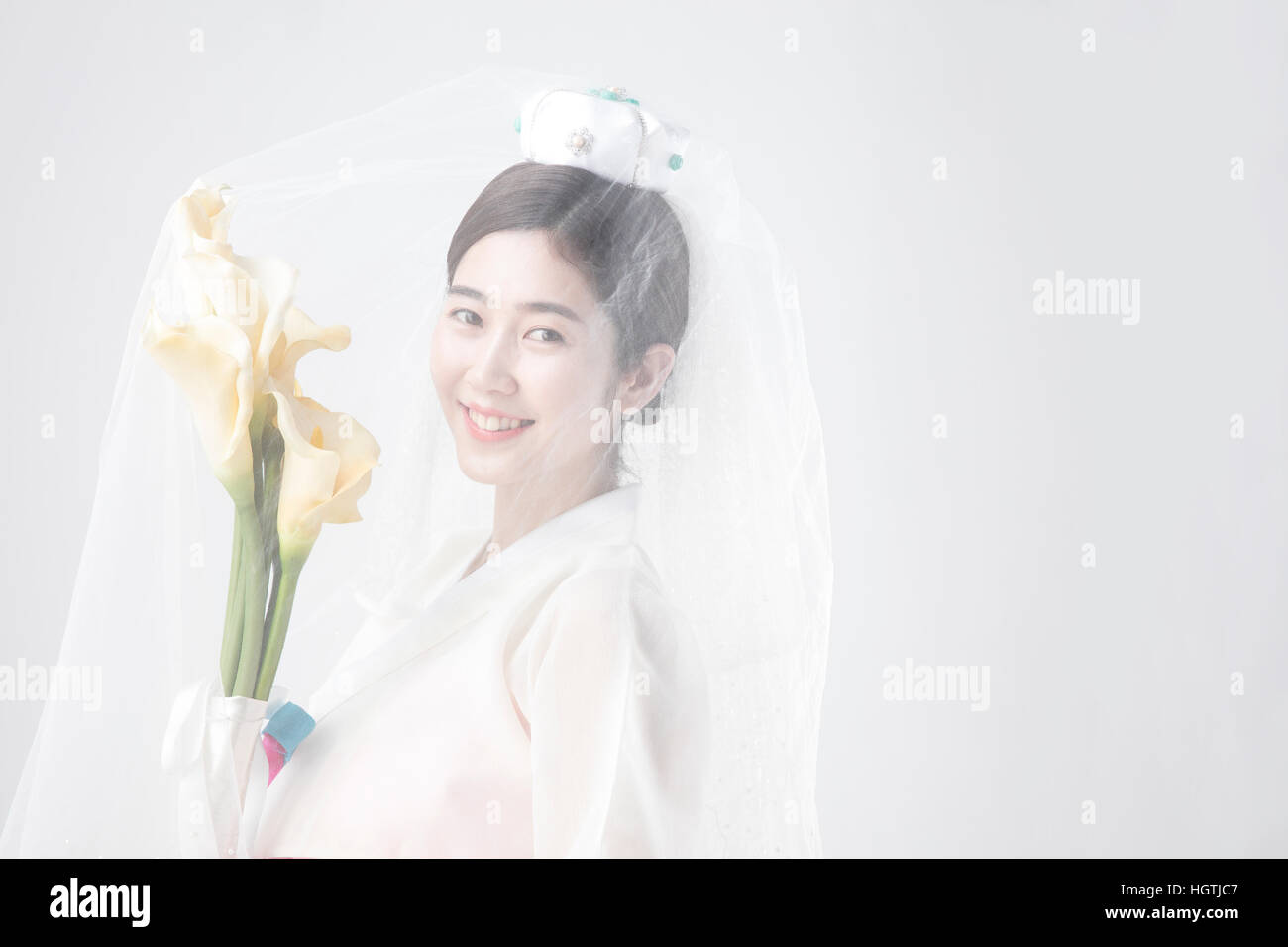 Side view portrait of young smiling bride in traditional Korean wedding ...
