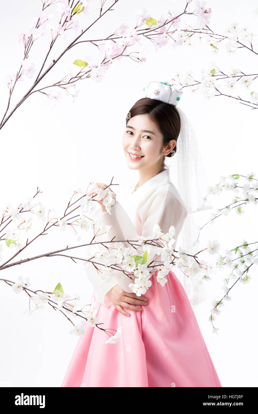 Side view of young smiling woman in traditional Korean clothes in ...