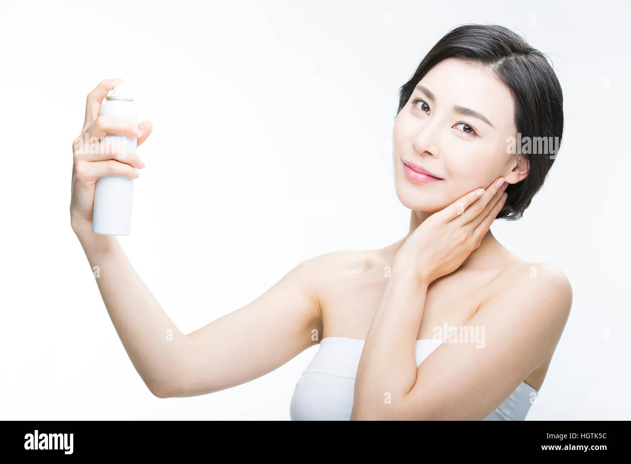 Woman spraying face hi-res stock photography and images - Alamy