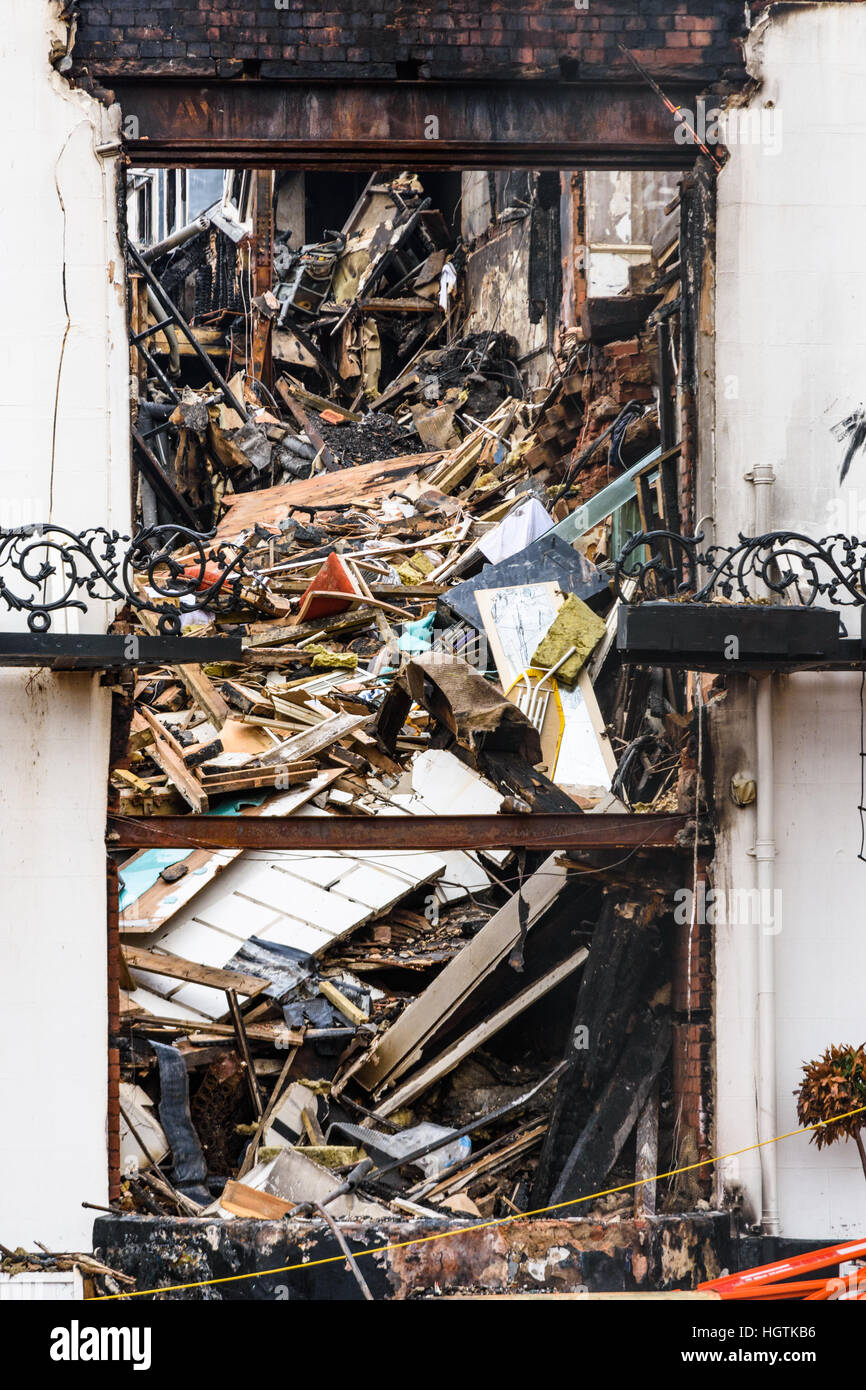 Looking through a window into the fire damaged Royal Clarence Hotel in ...