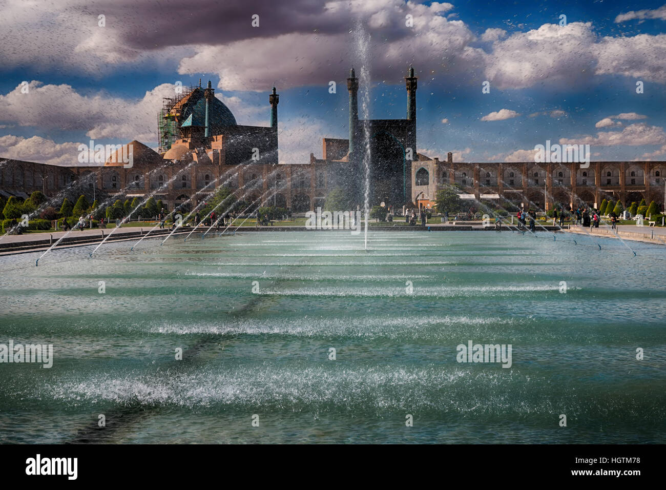 in iran old square mosque and fountain water backlight Stock Photo - Alamy