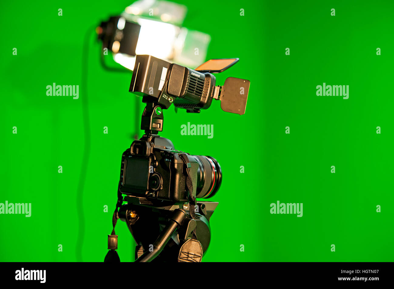 video camera on a green background Stock Photo - Alamy