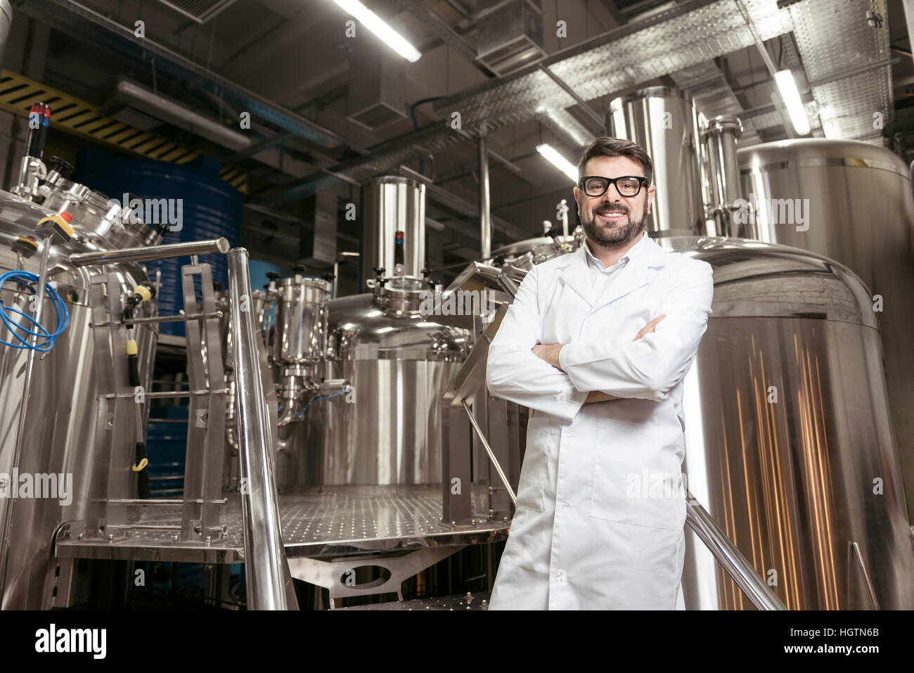 Joyful man posing with brewing mechanisms Stock Photo - Alamy