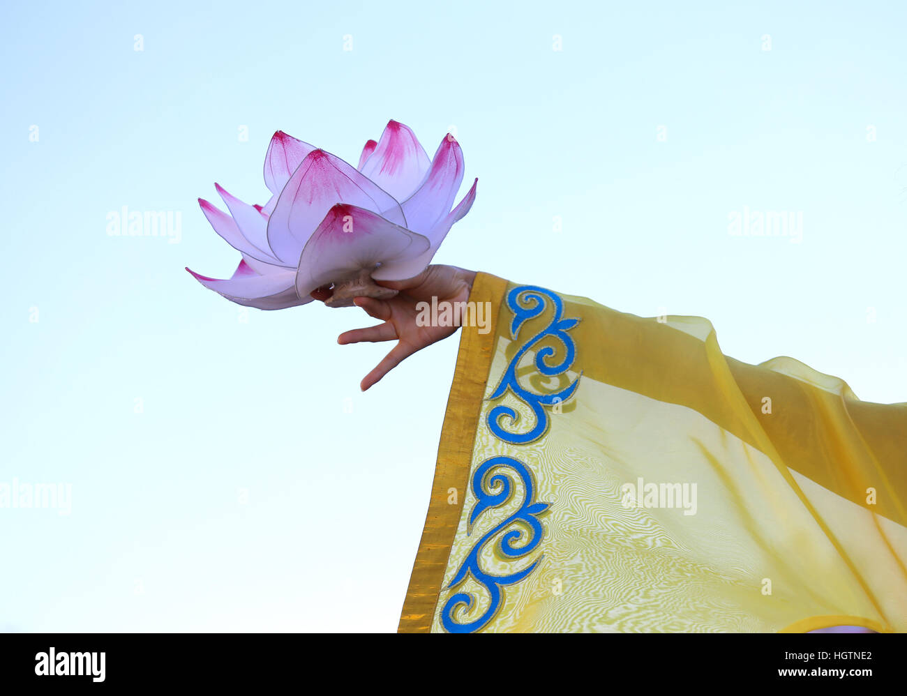 big flower lotus supported by the hands of the young oriental dancer ...