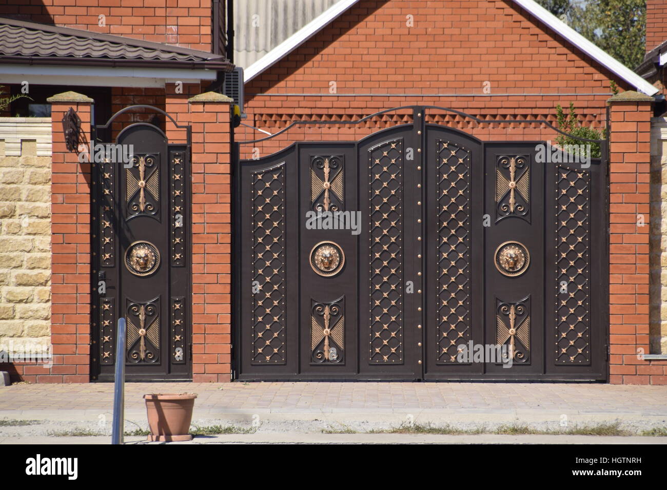 Gates of brown metal sheets. Roofing materials. Modern types of roofing ...