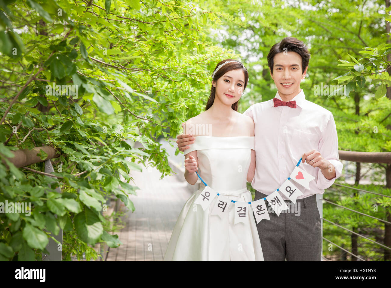 Young smiling wedding couple outdoors Stock Photo - Alamy