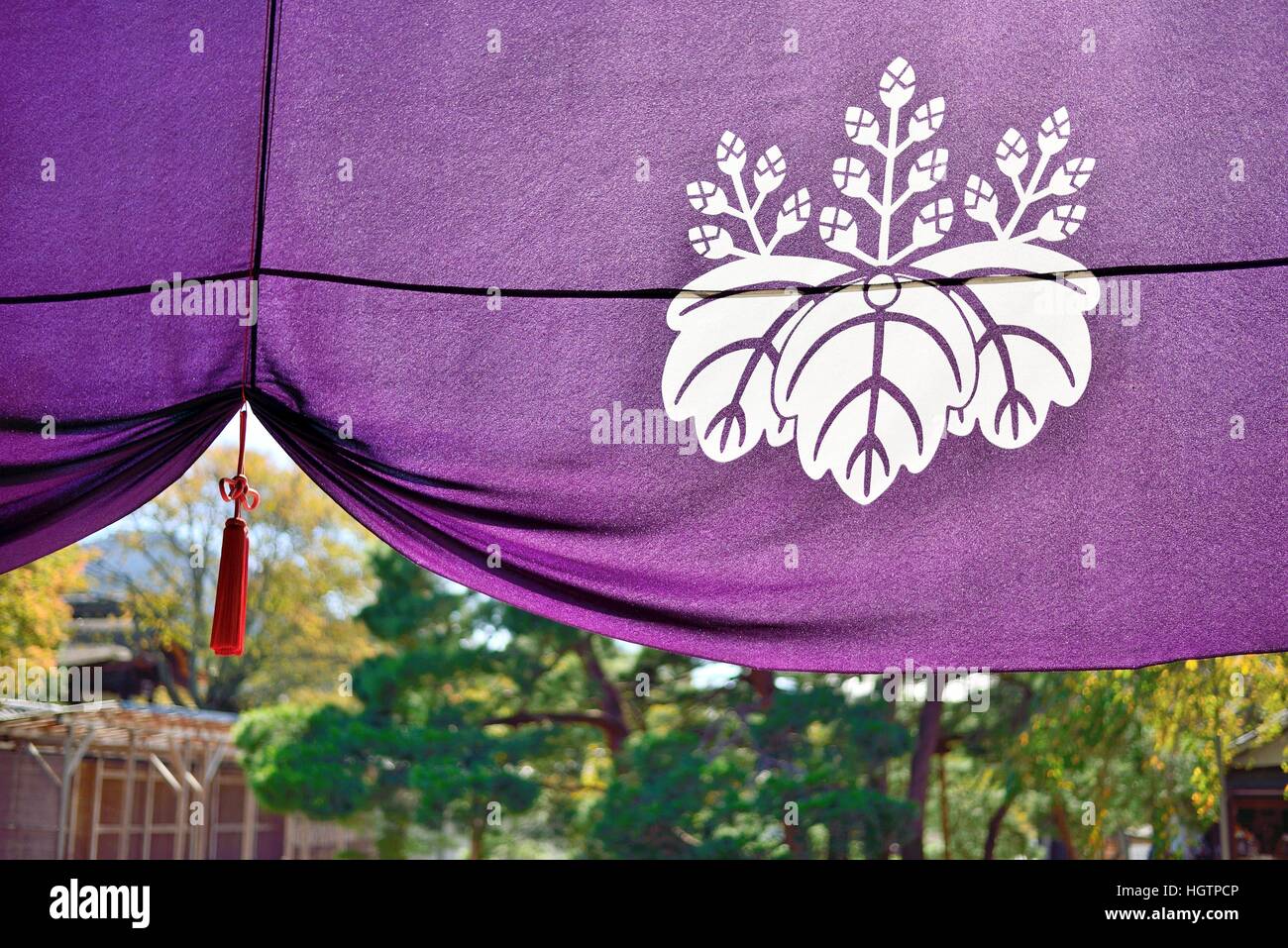 Purple Japanese temple curtain with historical emblem of Toyotomi clan ...