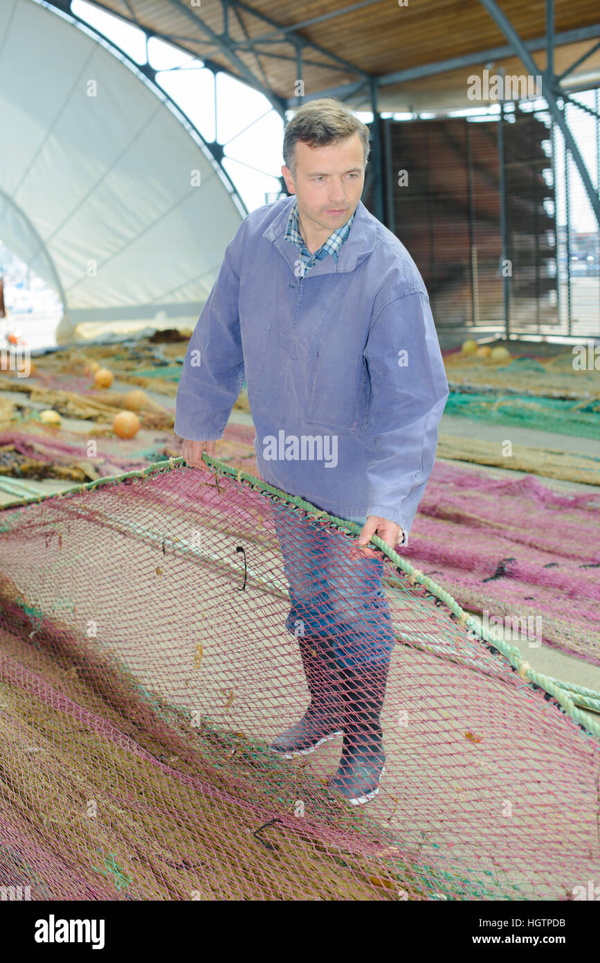 Untangling nets hi-res stock photography and images - Alamy