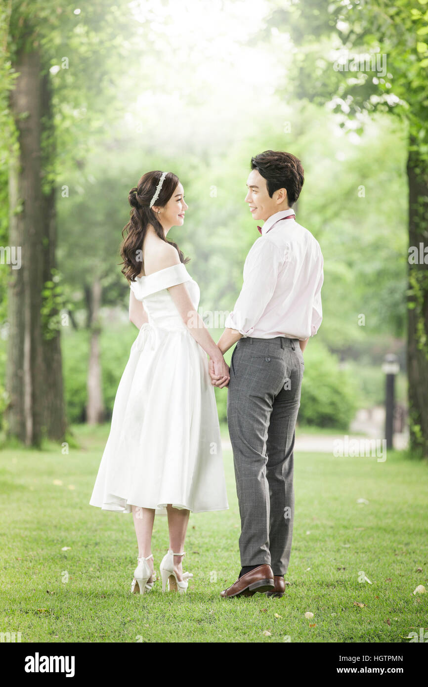 Romantic couple standing face hi-res stock photography and images - Alamy